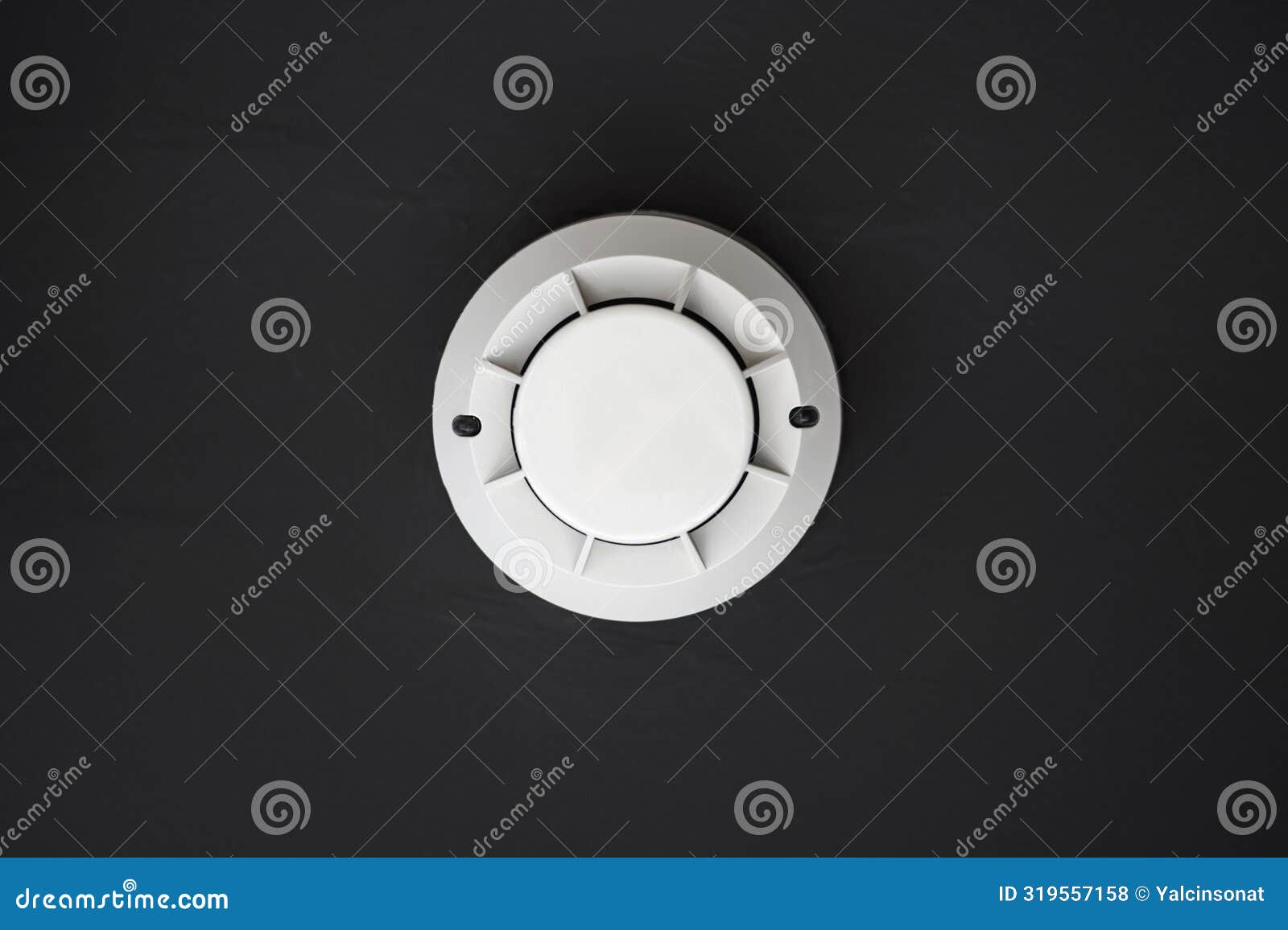 Fire and Smoke Detector Visible from Below on Black Ceiling Stock Photo ...