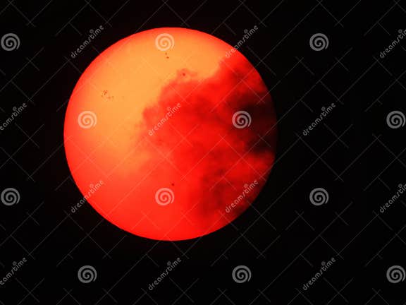 Fire Red Sun with Clouds Covering Showing Sunspots Stock Image - Image ...