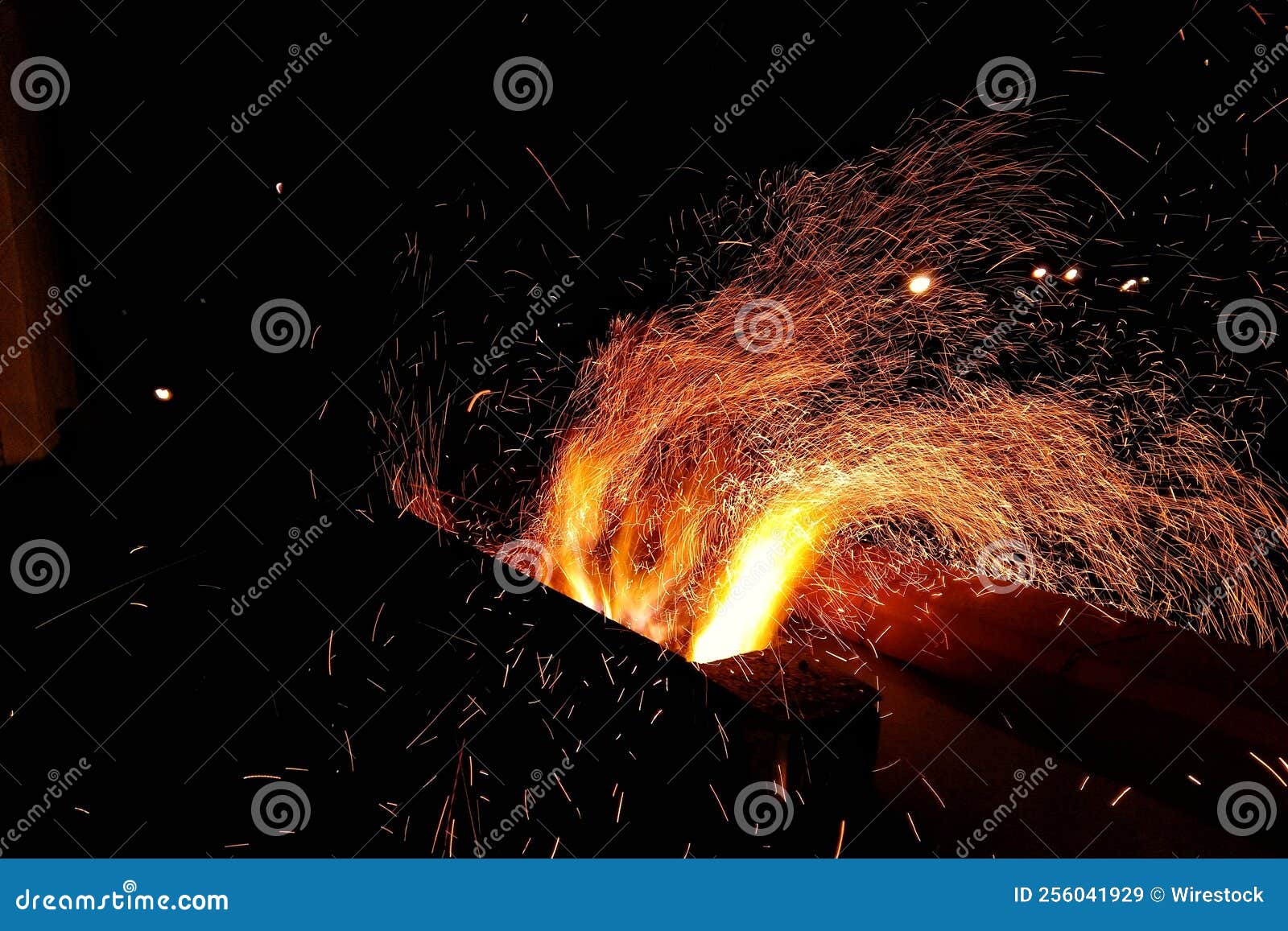 Fire sparks at night stock image. Image of fire, orange - 256041929