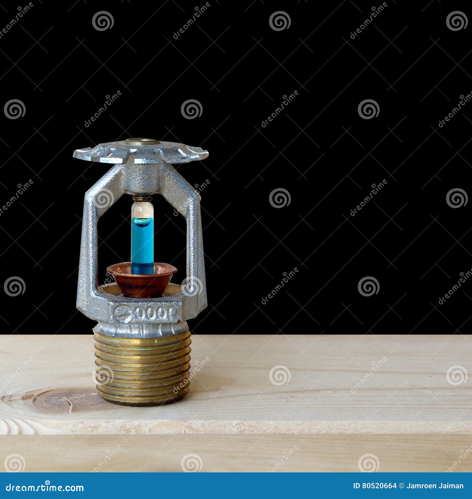 Fire Sprinkler with Fire on Wooden Background. Stock Photo - Image of ...