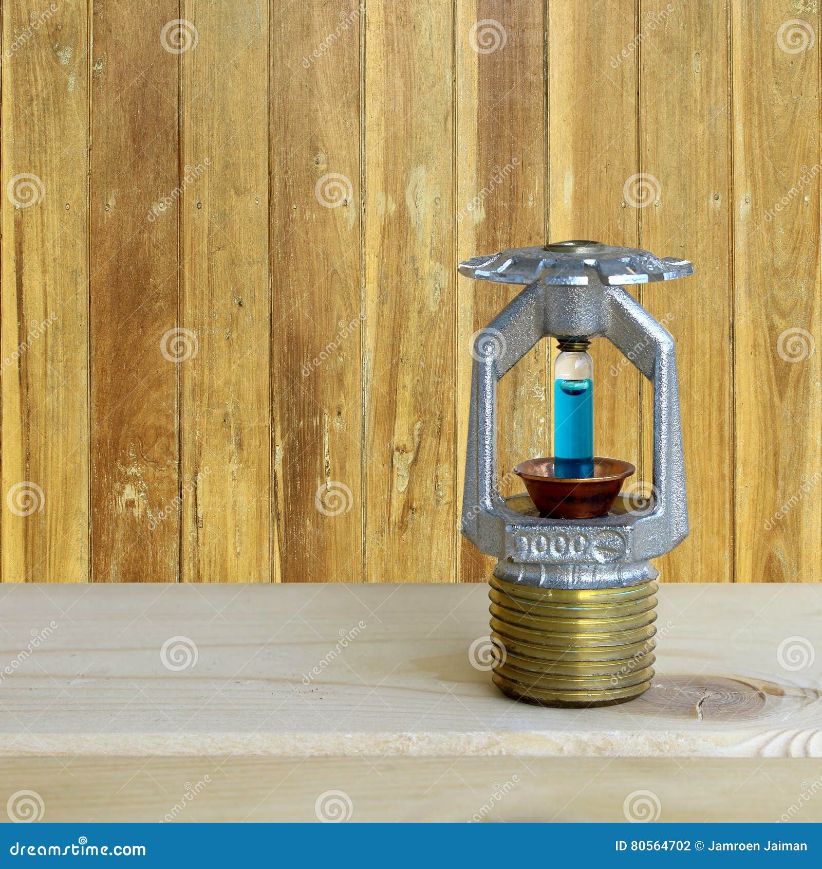 Fire Sprinkler with Fire on Wooden Background. Stock Photo - Image of ...