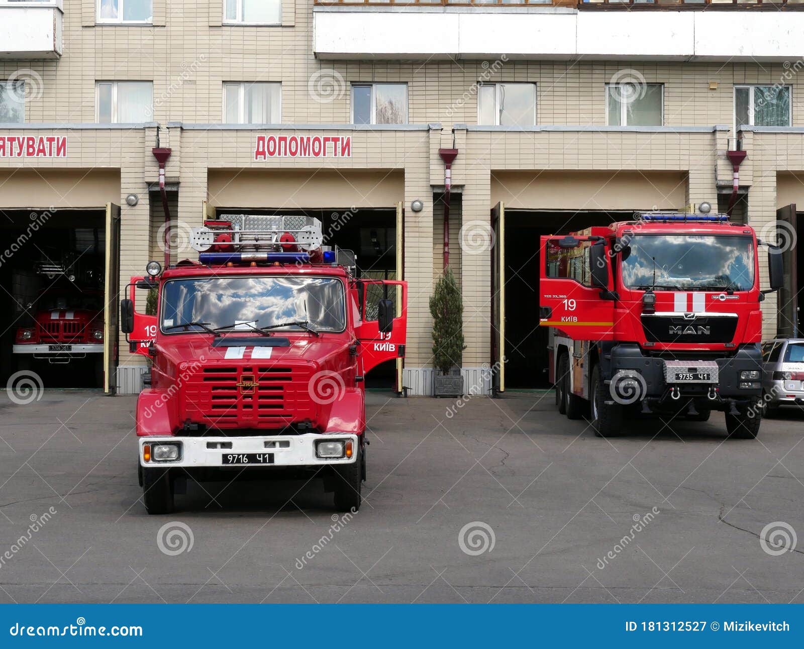 Red Fire Engines Standing at the Fire Station during the Day. Editorial ...