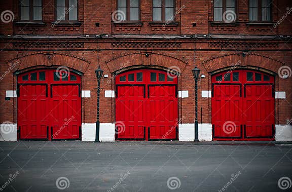 Fire Station with Red Doors Stock Photo - Image of lantern, landmark ...