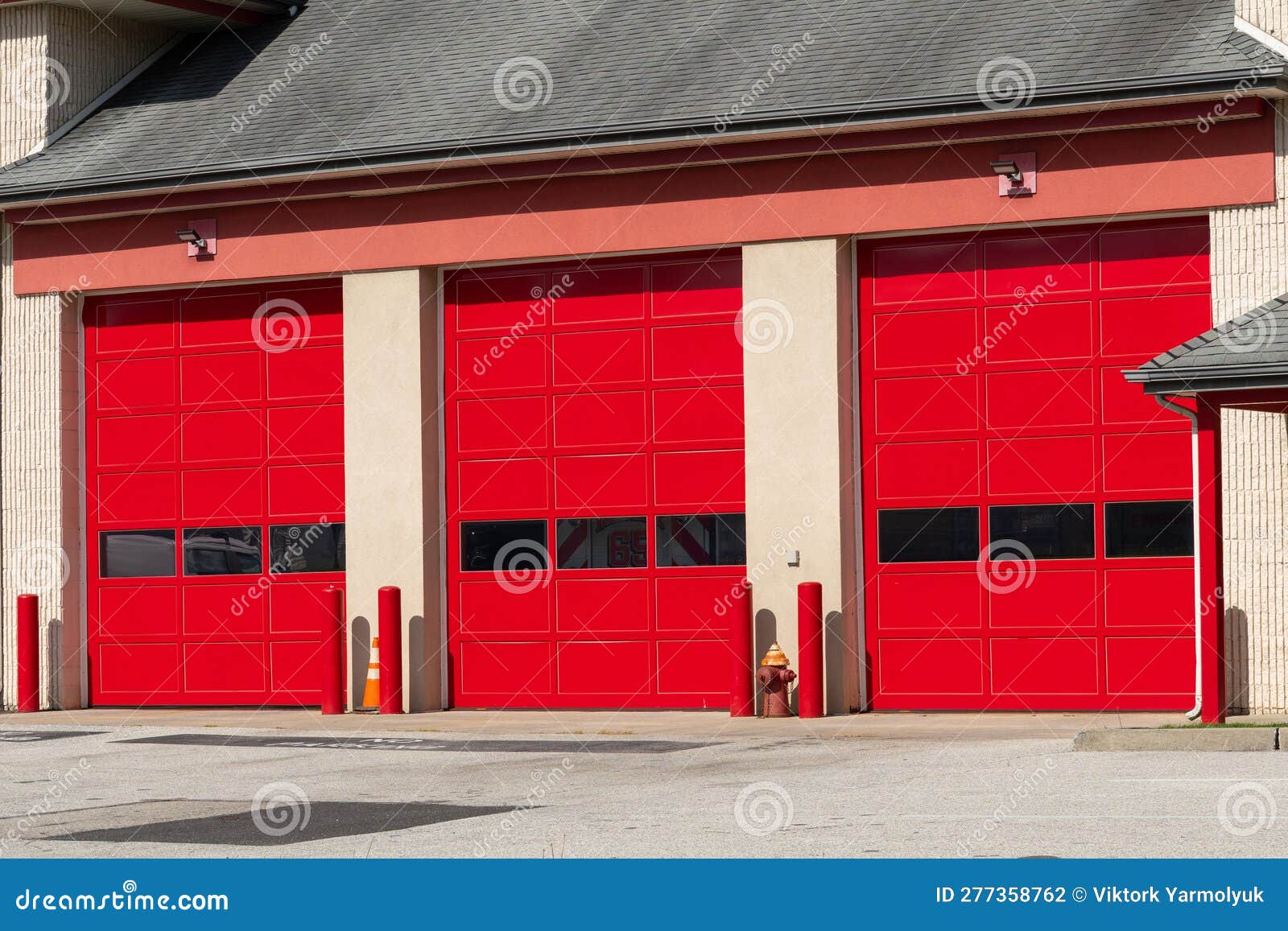 Fire station red doors stock photo. Image of detail - 277358762