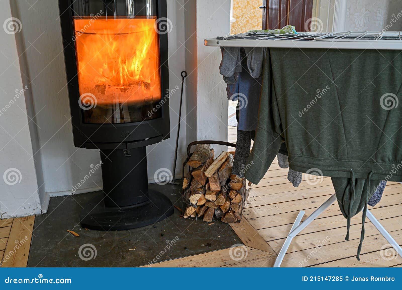 Fire in Stove Drying Clothes on Drying Rack Stock Image - Image of ...