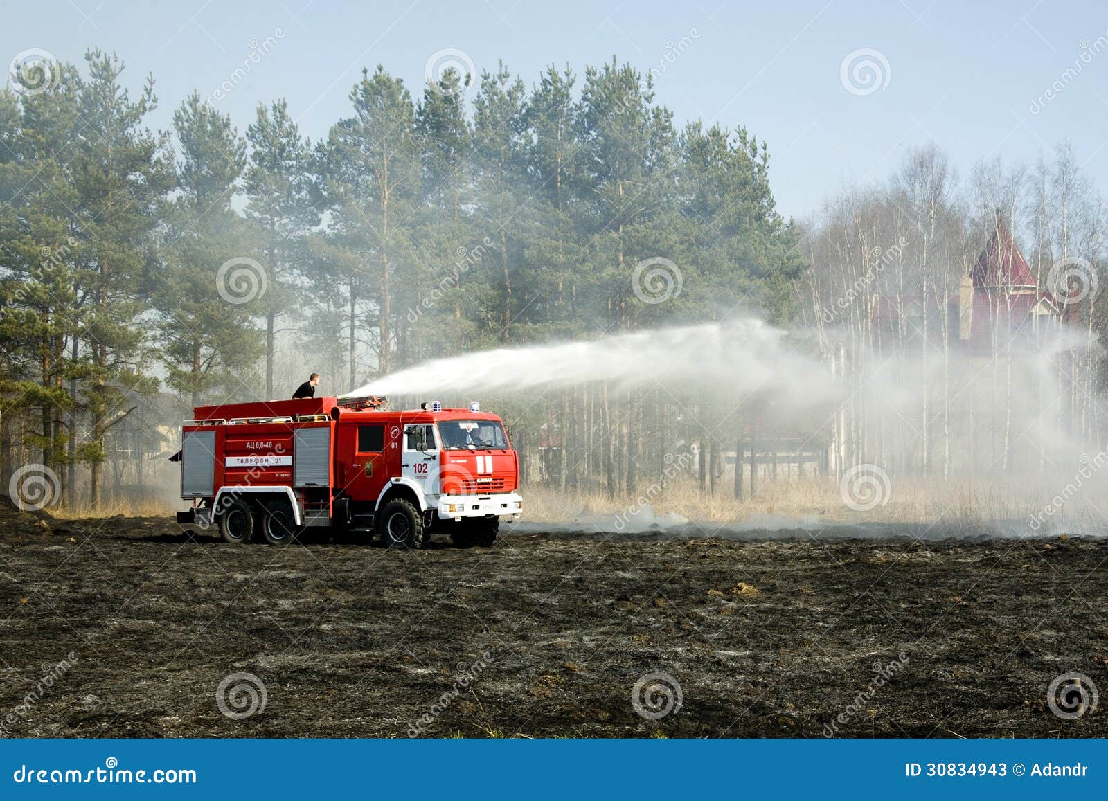 The Fire Truck Extinguishes a Fire Editorial Stock Photo - Image of ...