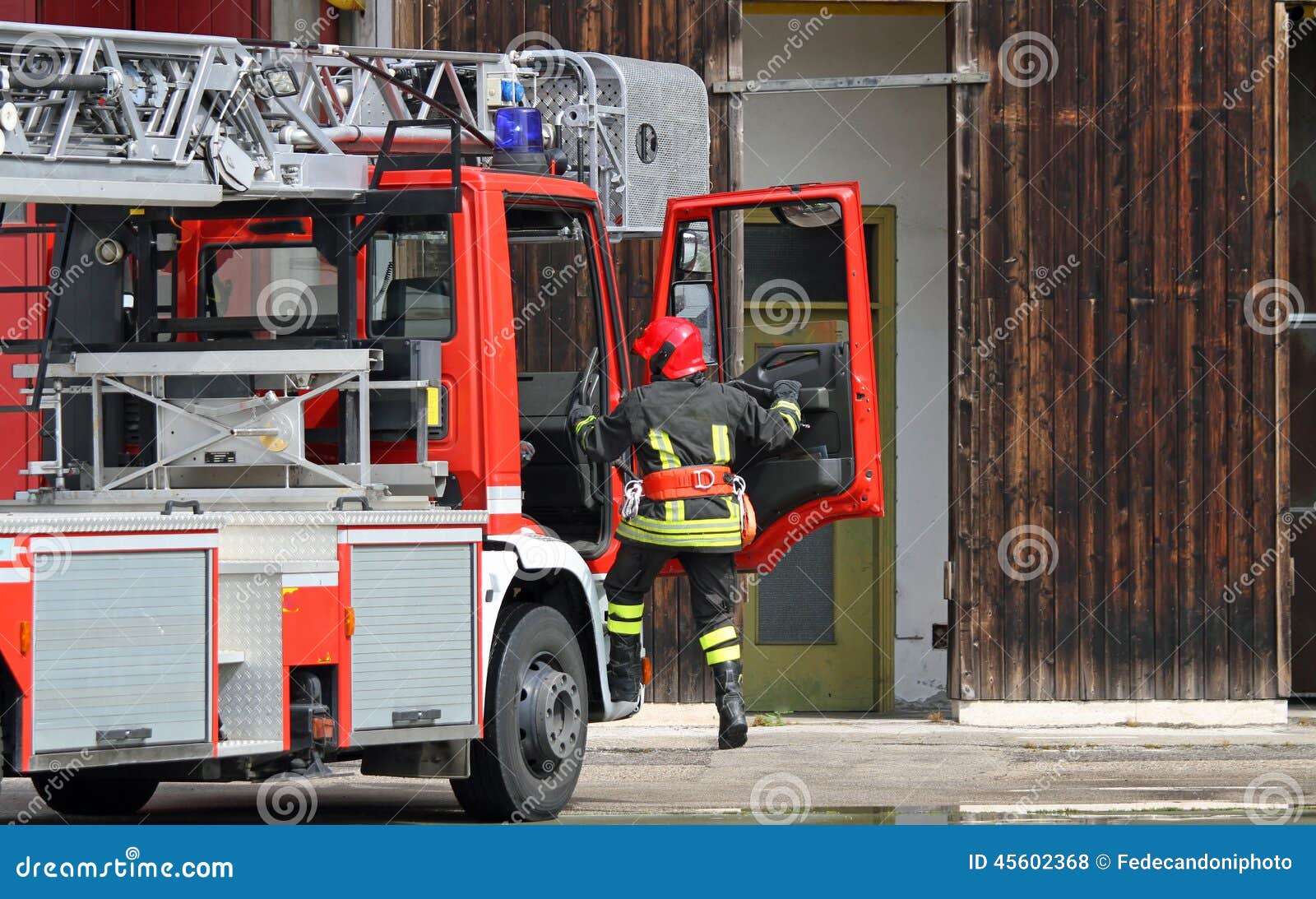 Fire Truck with a Firefighter during an Emergency Call Stock Photo ...