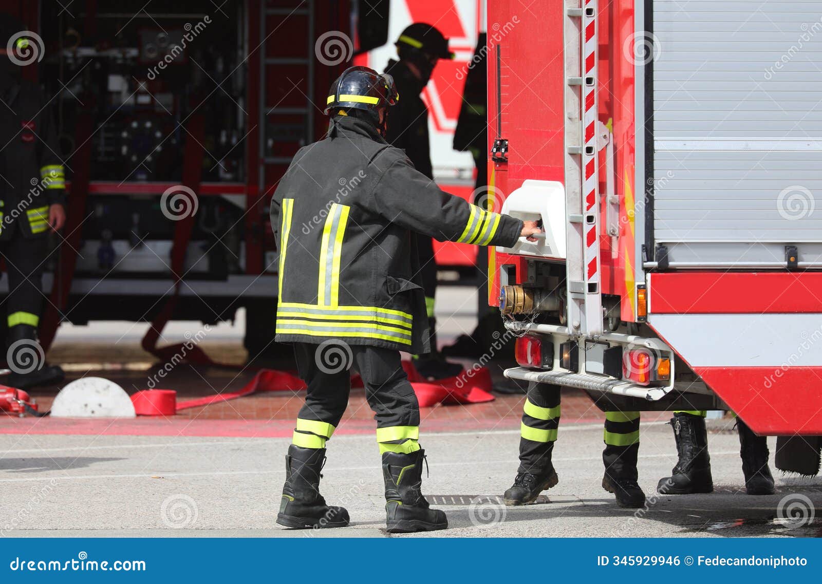 Fire Truck during Firefighter Intervention with Firefighters in Uniform ...