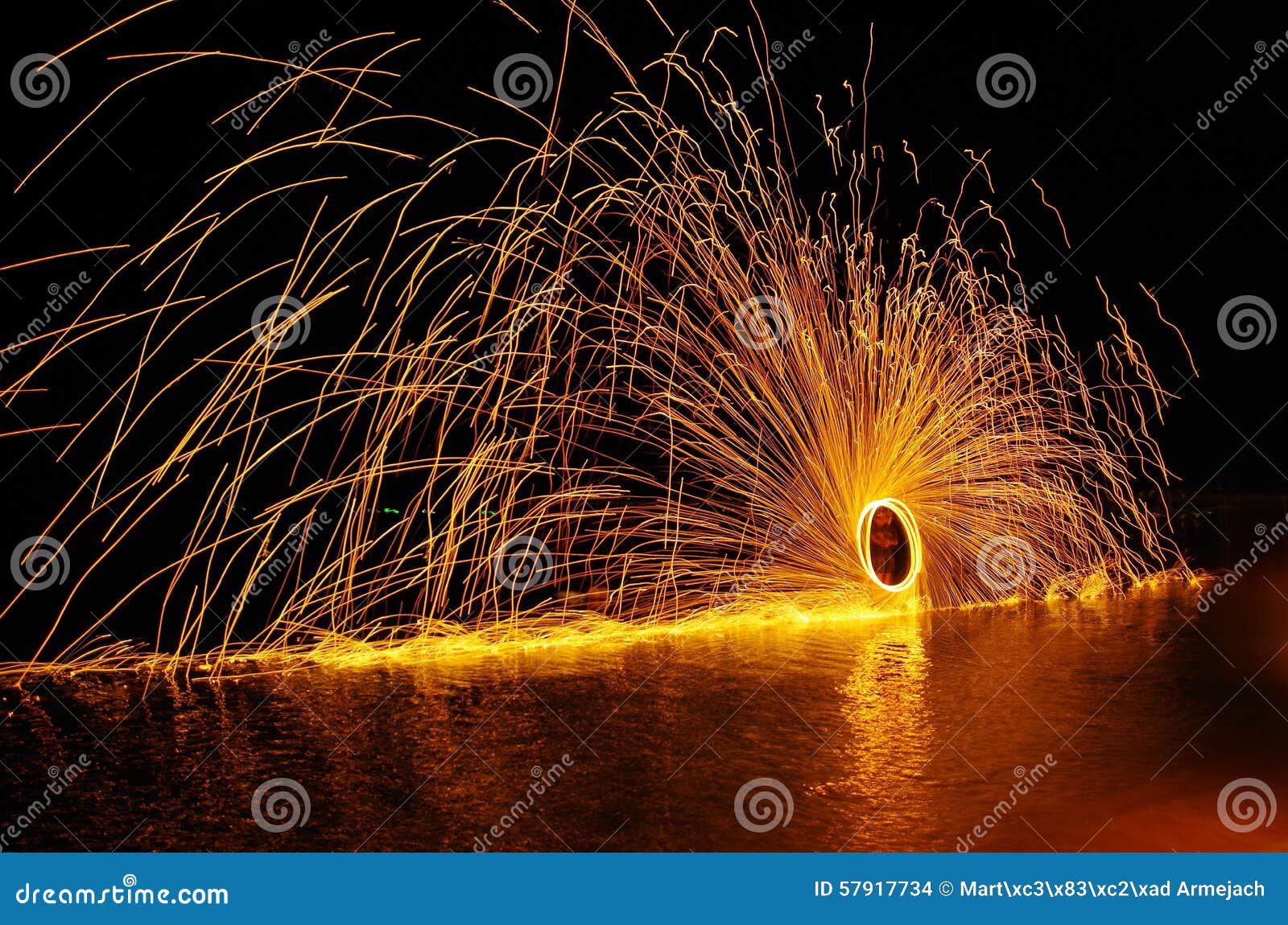 Fire on the water stock photo. Image of beach, fire, show - 57917734