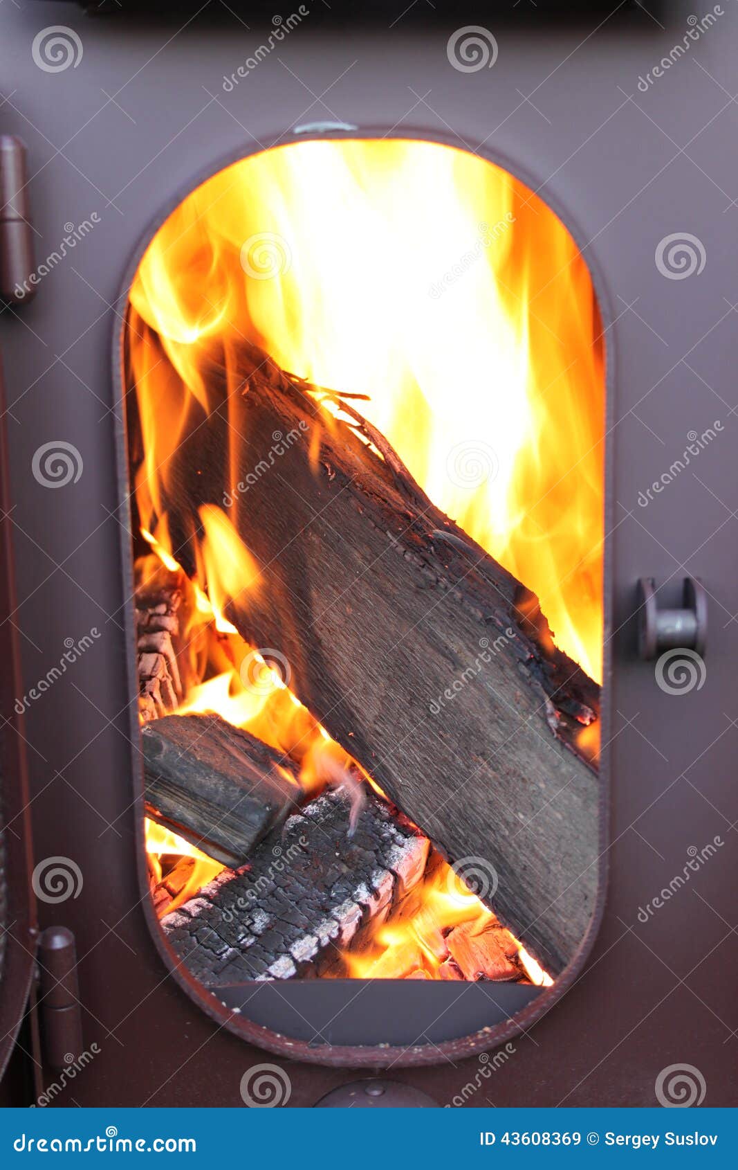 Fire-wood are Burning in a Fire-chamber of a Stove with an Opened Door ...