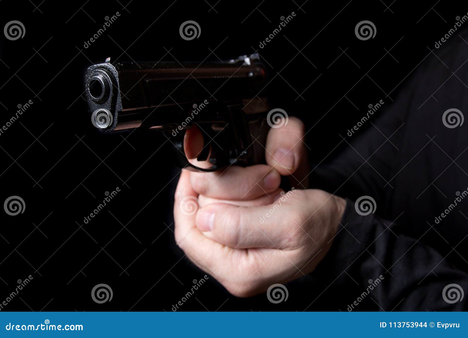 A Firearm in the Hands of a Man Defending or Attacking Stock Photo ...