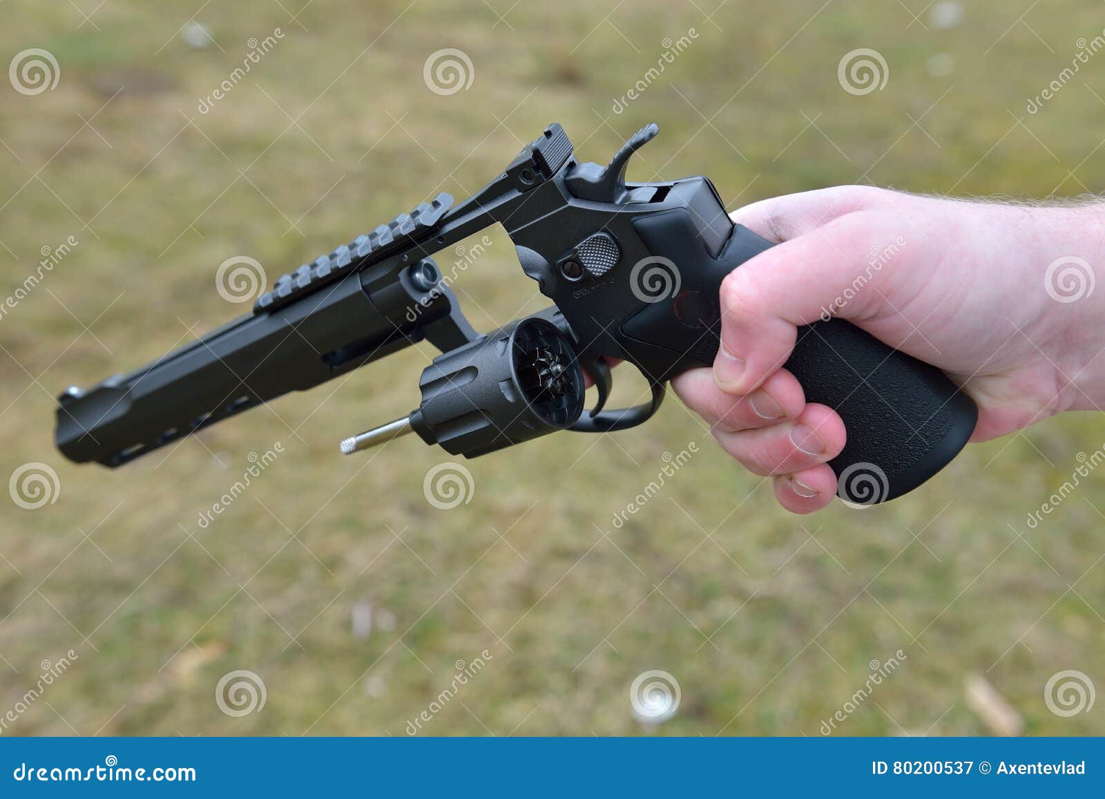 Firearms and Security Topic: Hand Man with a Gun Ready To Put Bu Stock ...