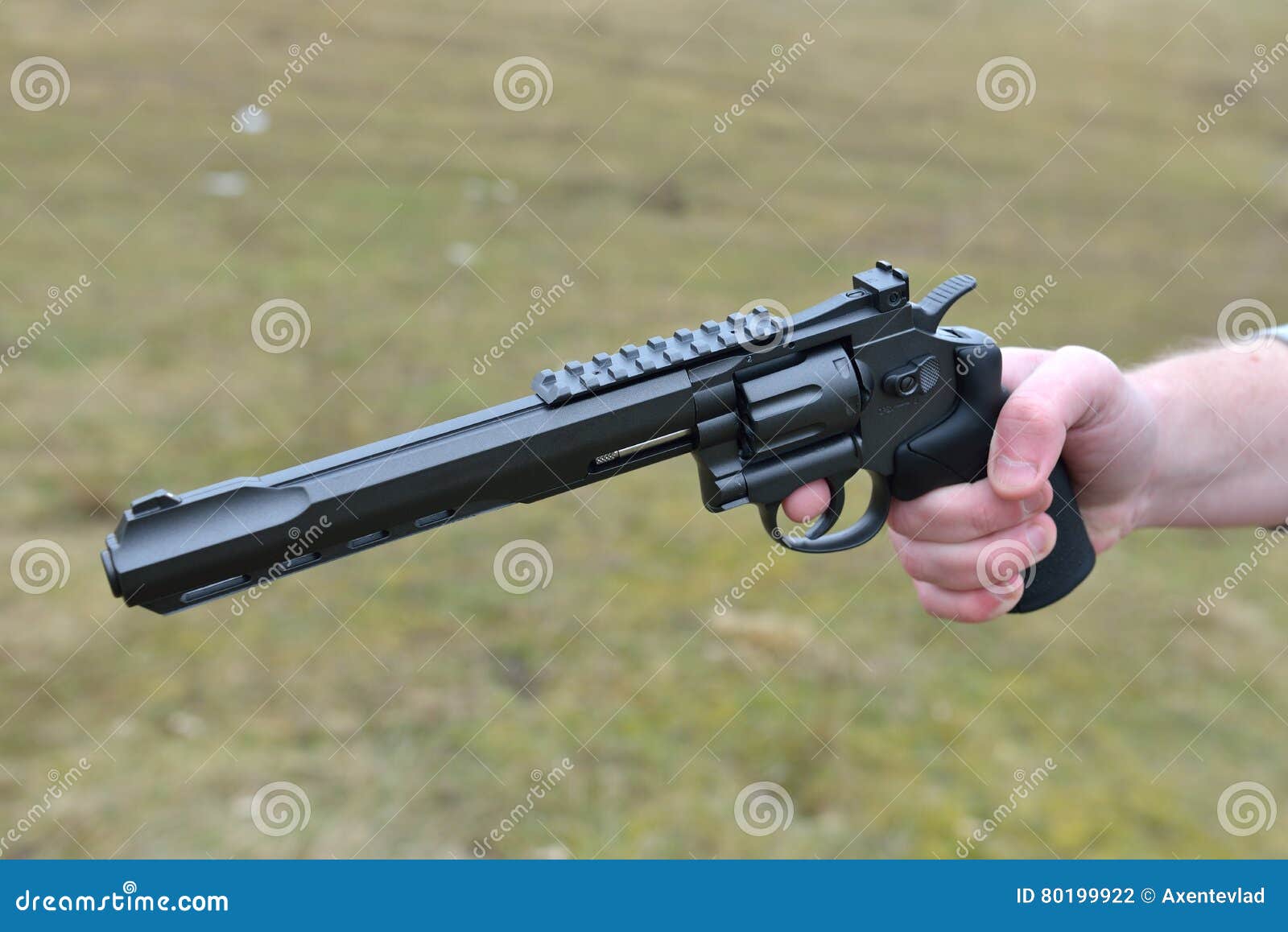 Firearms and Security Topic: Hand Man with a Gun Ready To Shoot Stock ...