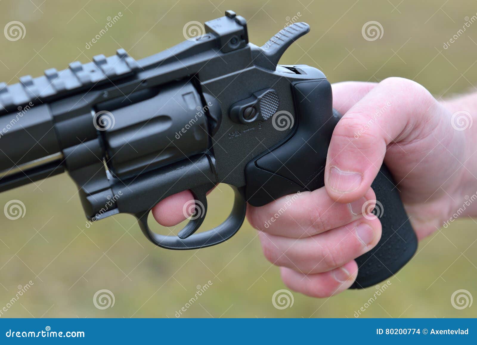 Firearms and Security Topic: Hand Man with a Gun Ready To Shoot Stock ...