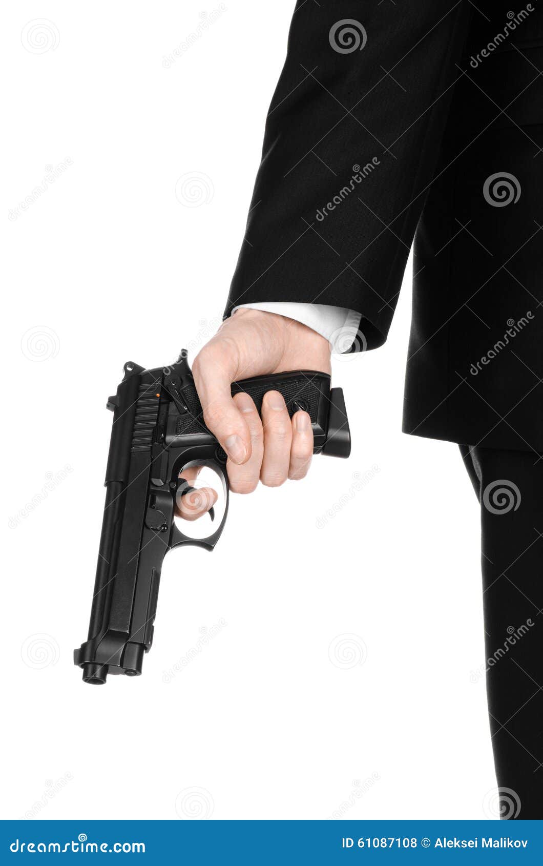 Firearms And Security Topic: A Man In A Black Suit Holding A Gun On An ...