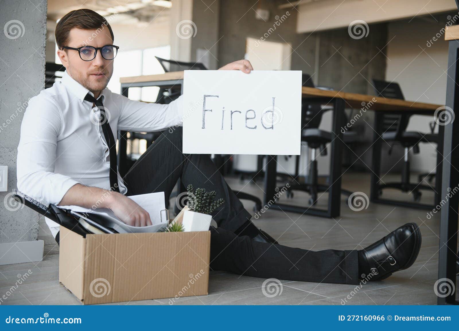 Fired Employee Holding Fired Sign in Hand Stock Photo - Image of ...