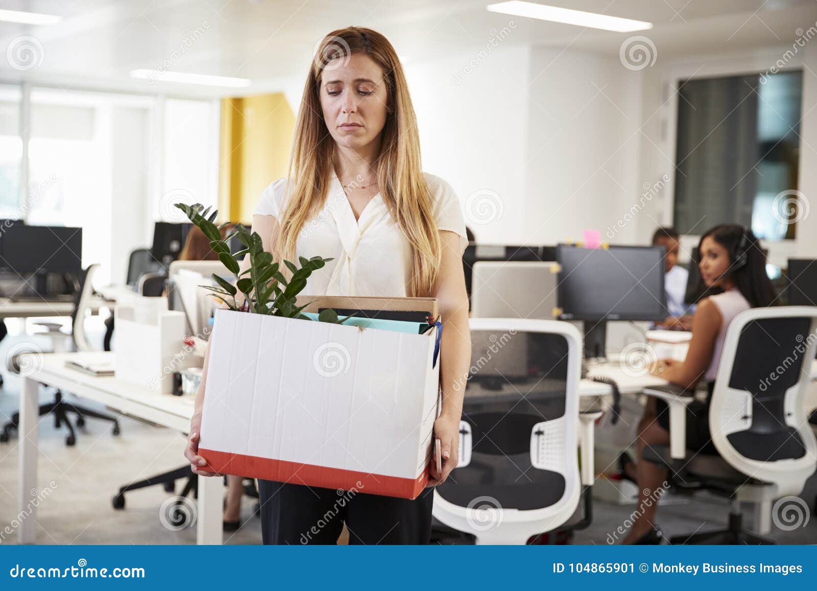 Fired Female Employee Holding Box of Belongings in an Office Stock ...