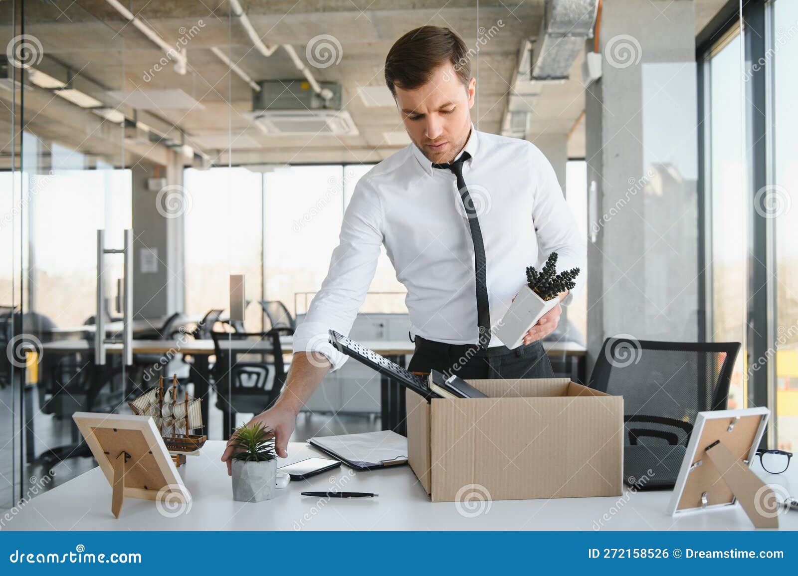 Fired Young Man Packing His Stuff in Office Stock Photo - Image of ...