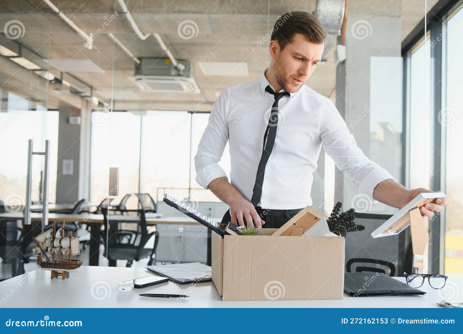 Fired Young Man Packing His Stuff in Office Stock Image - Image of ...