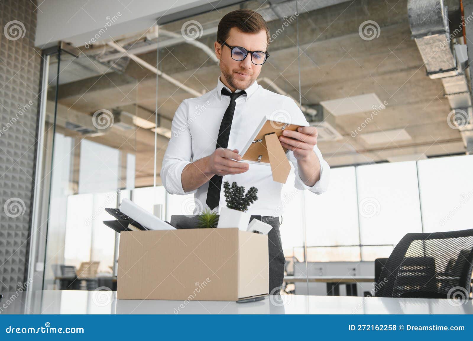 Fired Young Man Packing His Stuff in Office Stock Photo - Image of ...