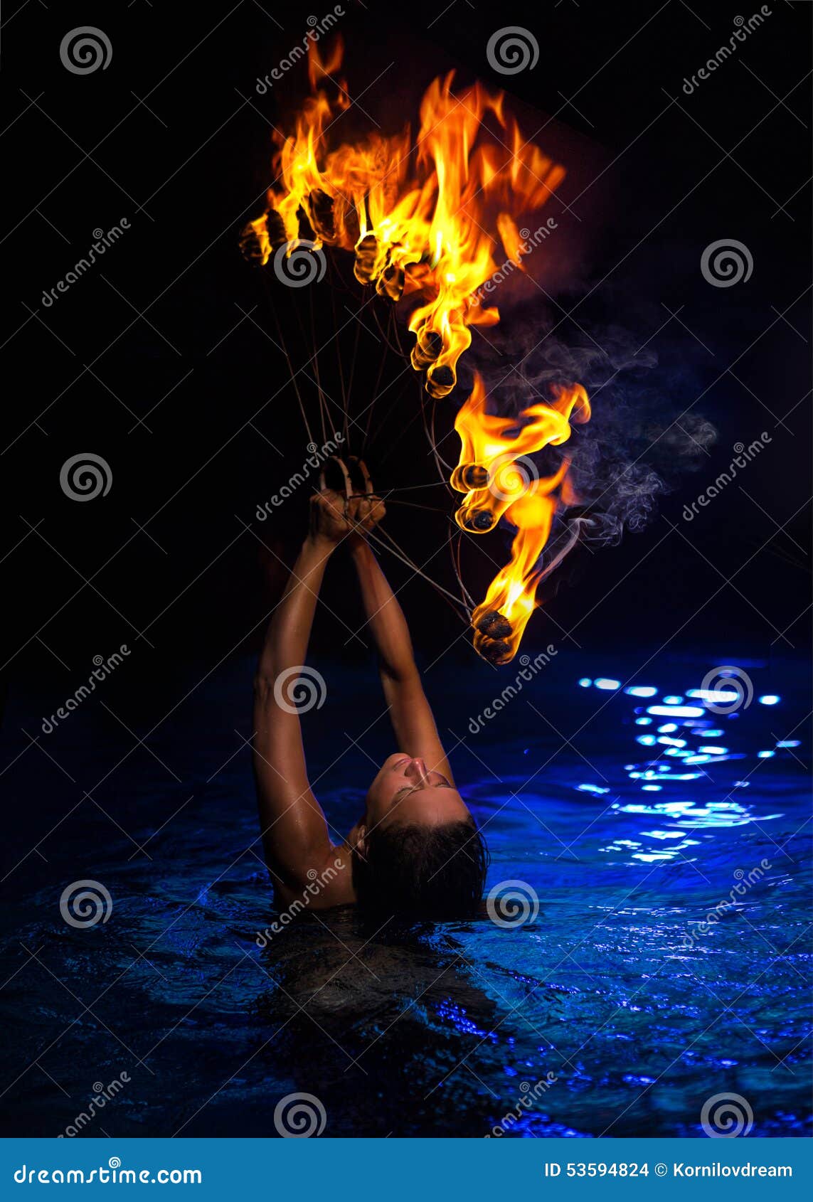 Firedancer woman in water stock photo. Image of hair - 53594824
