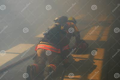 Firefigher and smoke stock image. Image of emergency - 43552829