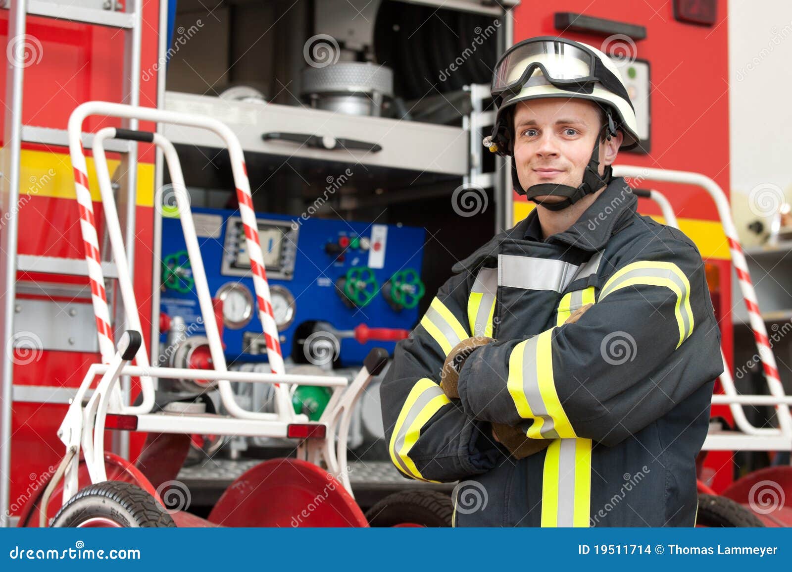 Real Firefighter With House On Fire In Background Royalty-Free Stock ...