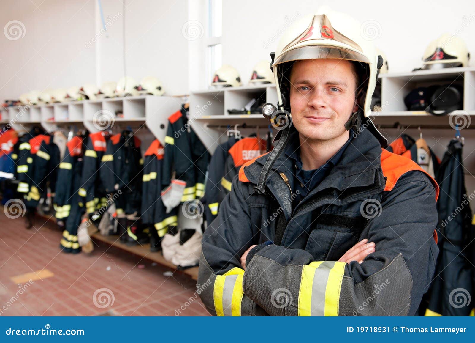 Real Firefighter With House On Fire In Background Royalty-Free Stock ...