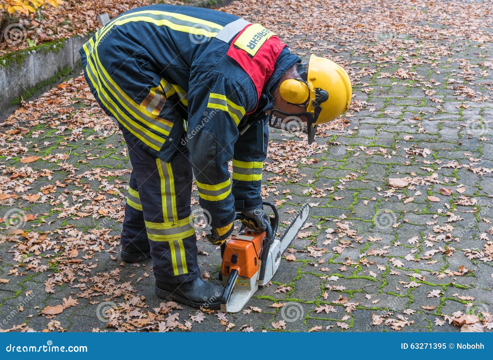 Firefighter in Action with Chain Saw Stock Image - Image of clothing ...