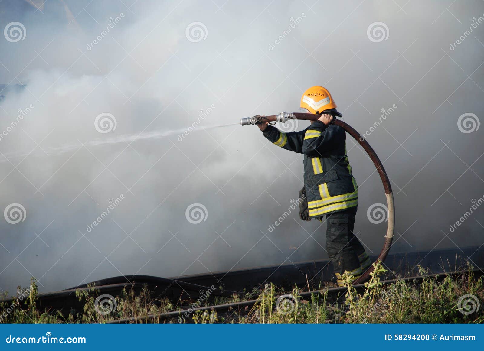 Firefighter in action stock photo. Image of extinguisher - 58294200