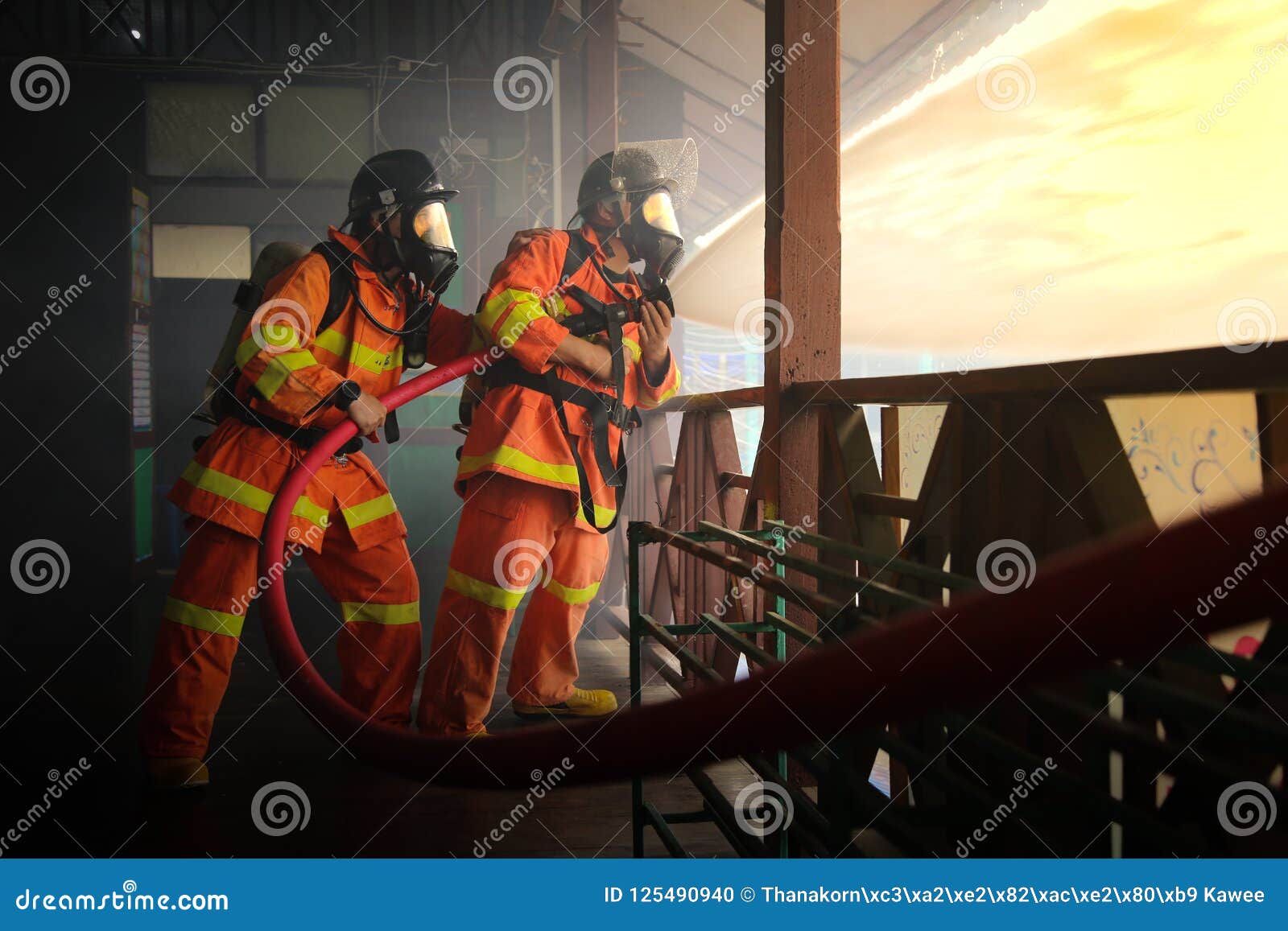 Firefighter in action editorial image. Image of courageous - 125490940