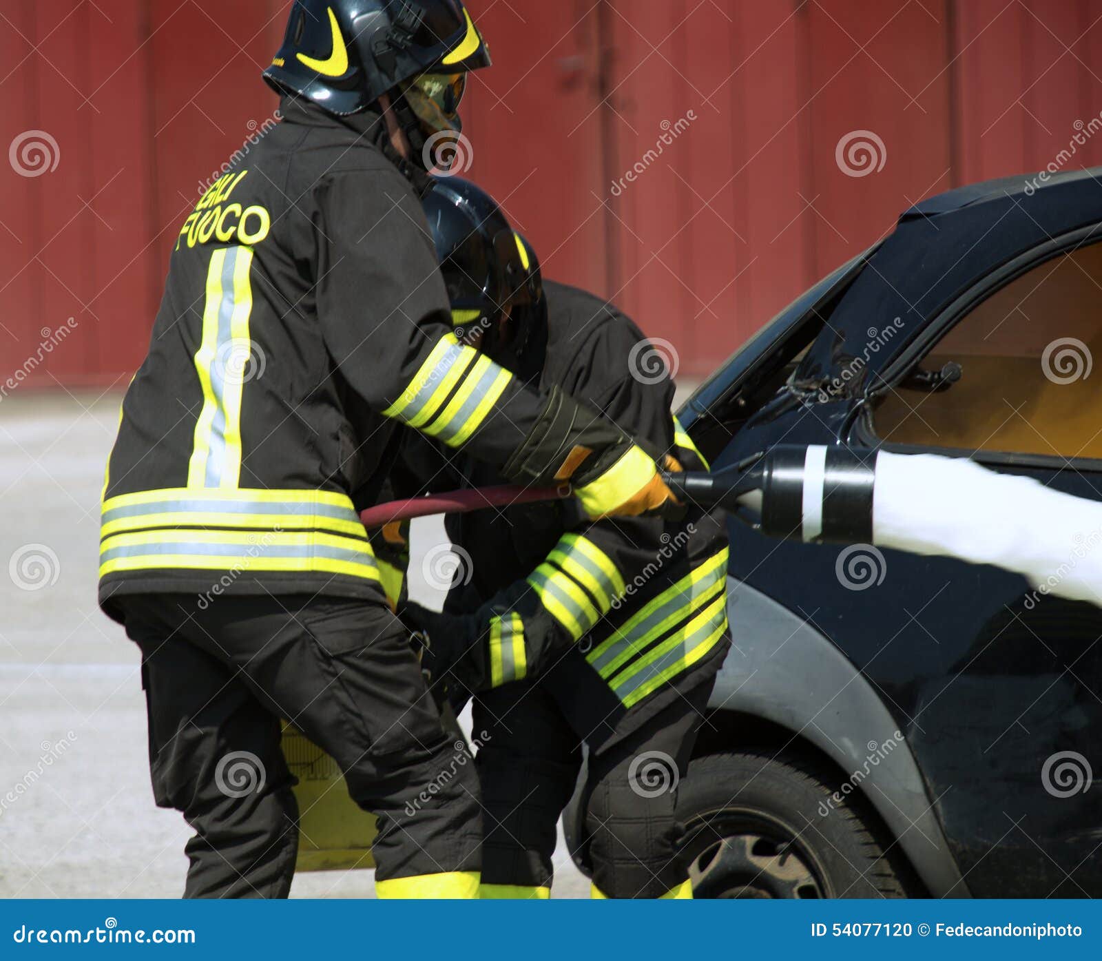 Firefighter in Action with Foam To Put Out the Fire Stock Photo - Image ...
