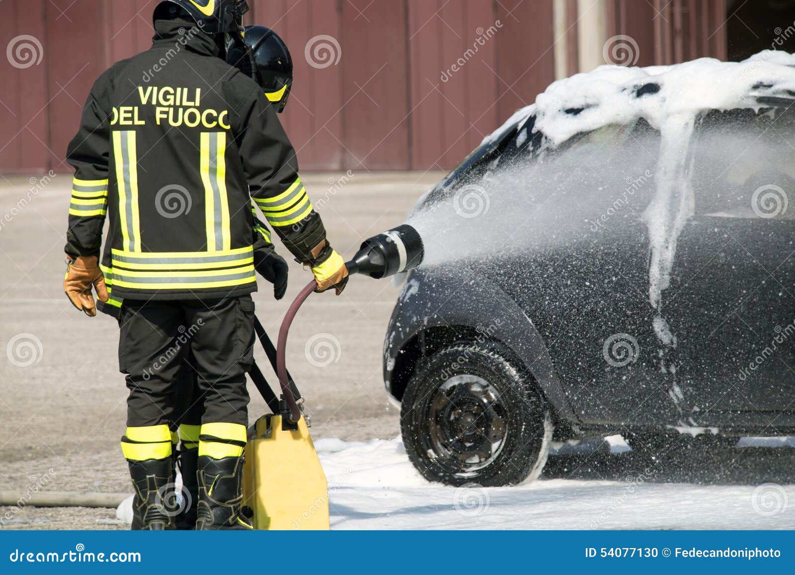 Firefighter in Action with Foam To Put Out the Fire Stock Photo - Image ...