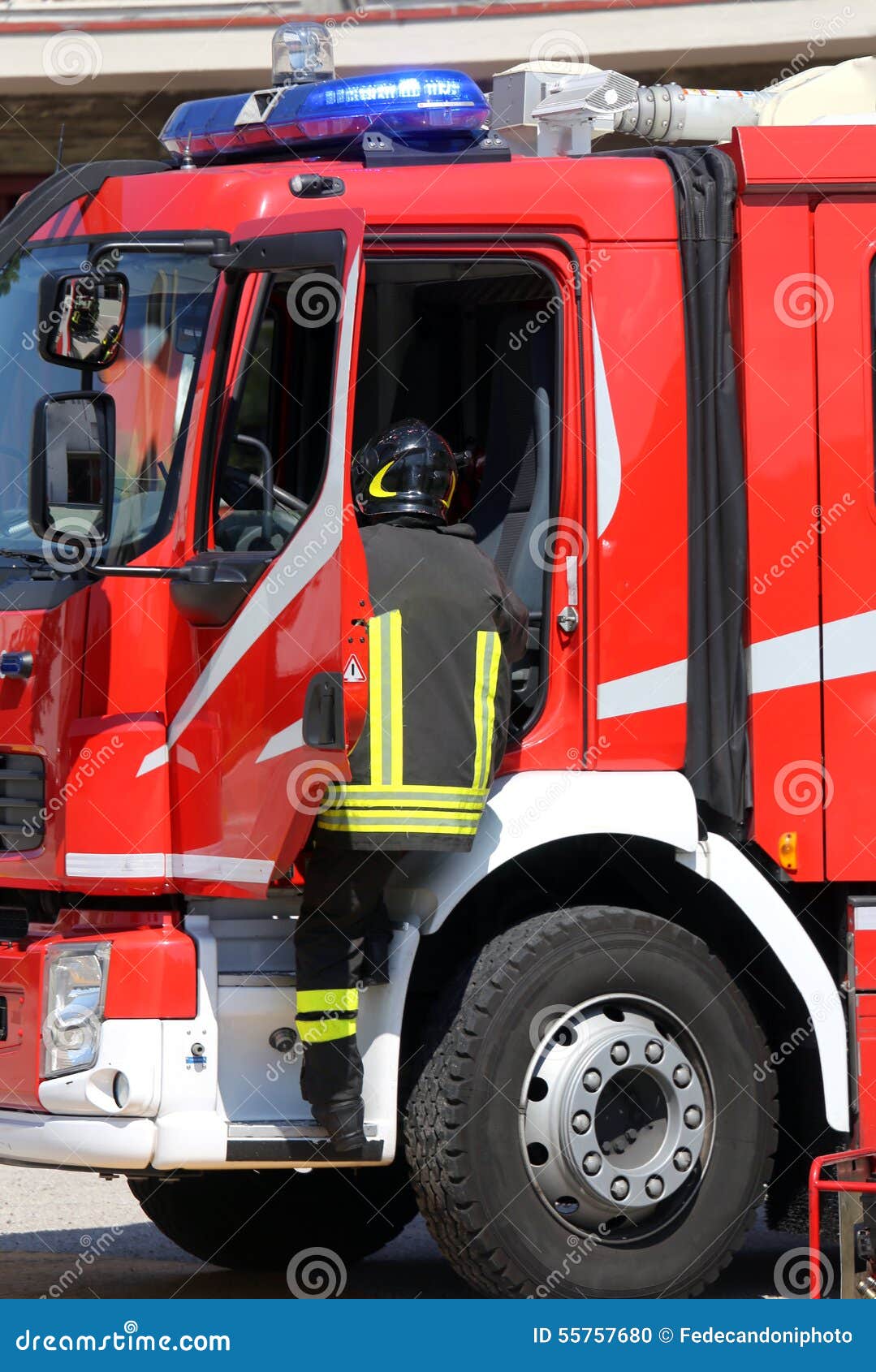 Firefighter in Action Jump Down Quickly from the Fire Truck Stock Photo ...
