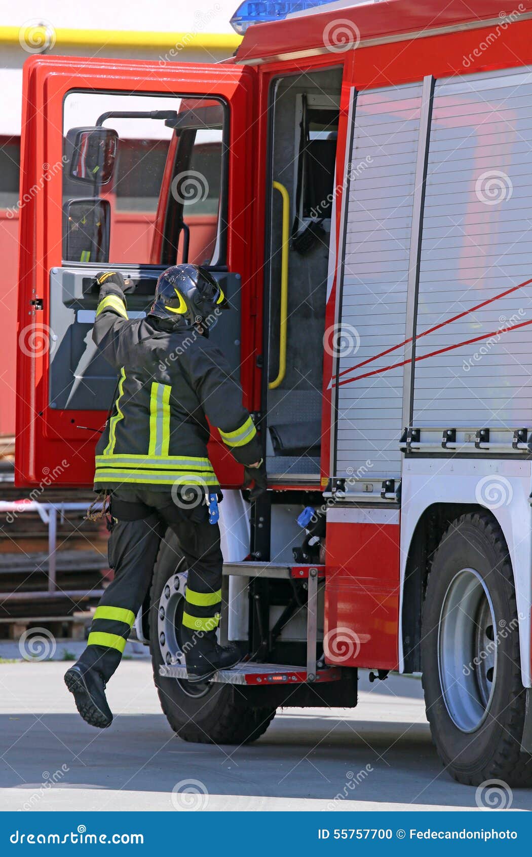 Firefighter in Action Jump Down Quickly from the Fire Truck Stock Photo ...