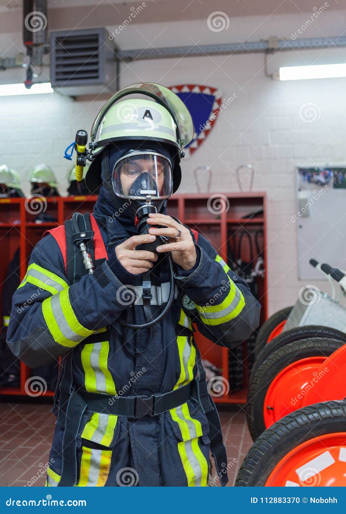 Firefighter With Oxygen Cylinder On The Fire Truck Royalty-Free Stock ...