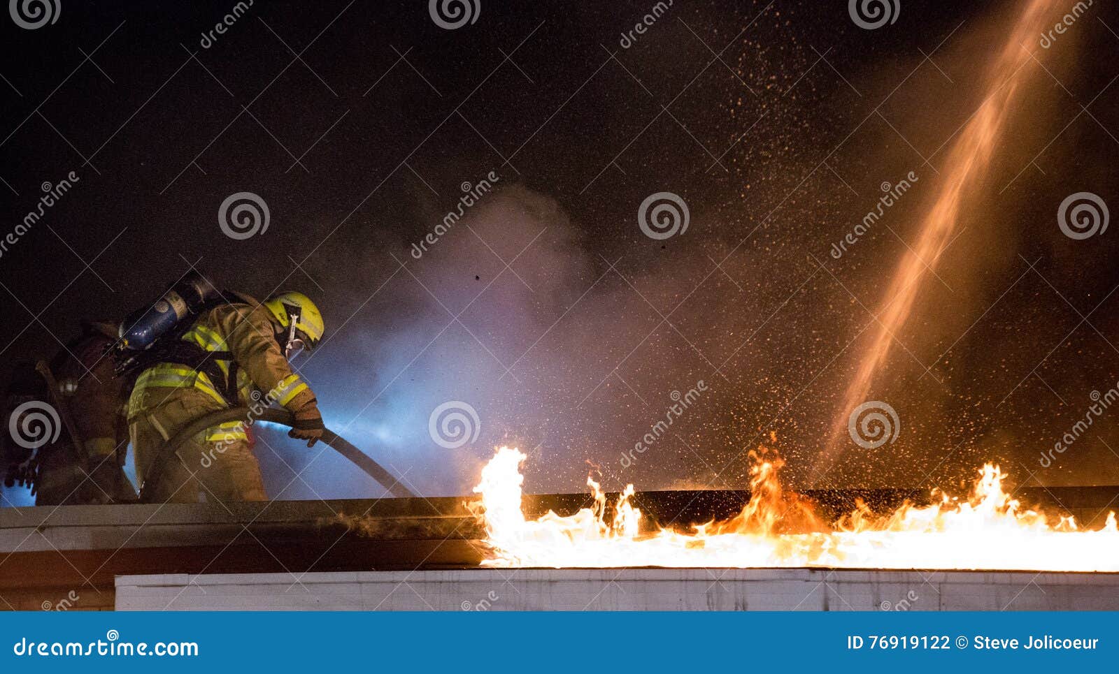 Firefighter in Action on the Roof Stock Photo - Image of hook, officer ...