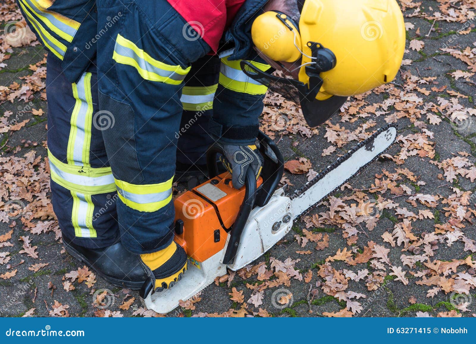 Firefighter in Action and Turn on the Chain Saw Stock Image - Image of ...