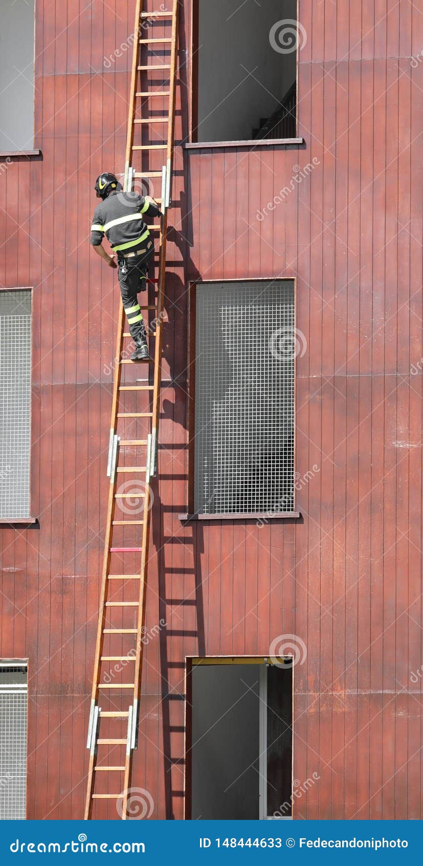 Firefighter in Action on the Wooden Ladder Editorial Stock Photo ...