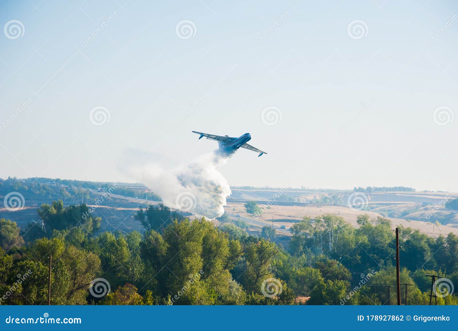 Firefighter Airplane Extinguishes a Forest Fire Stock Photo - Image of ...