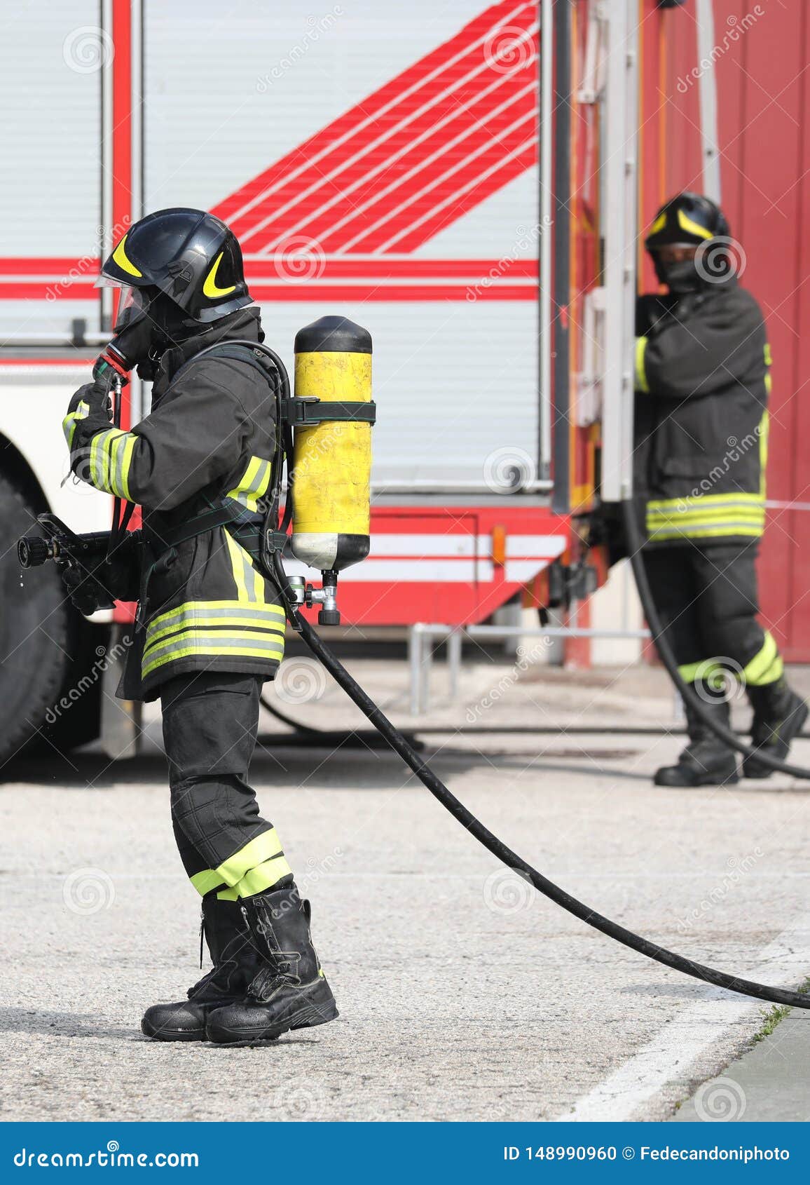 Firefighter with Apparatus and the Fire Engine Stock Photo - Image of ...