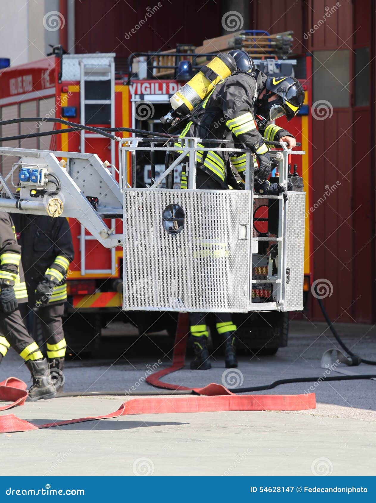 Firefighter on Cage of Fire Ladder Stock Image - Image of trucks, fire ...