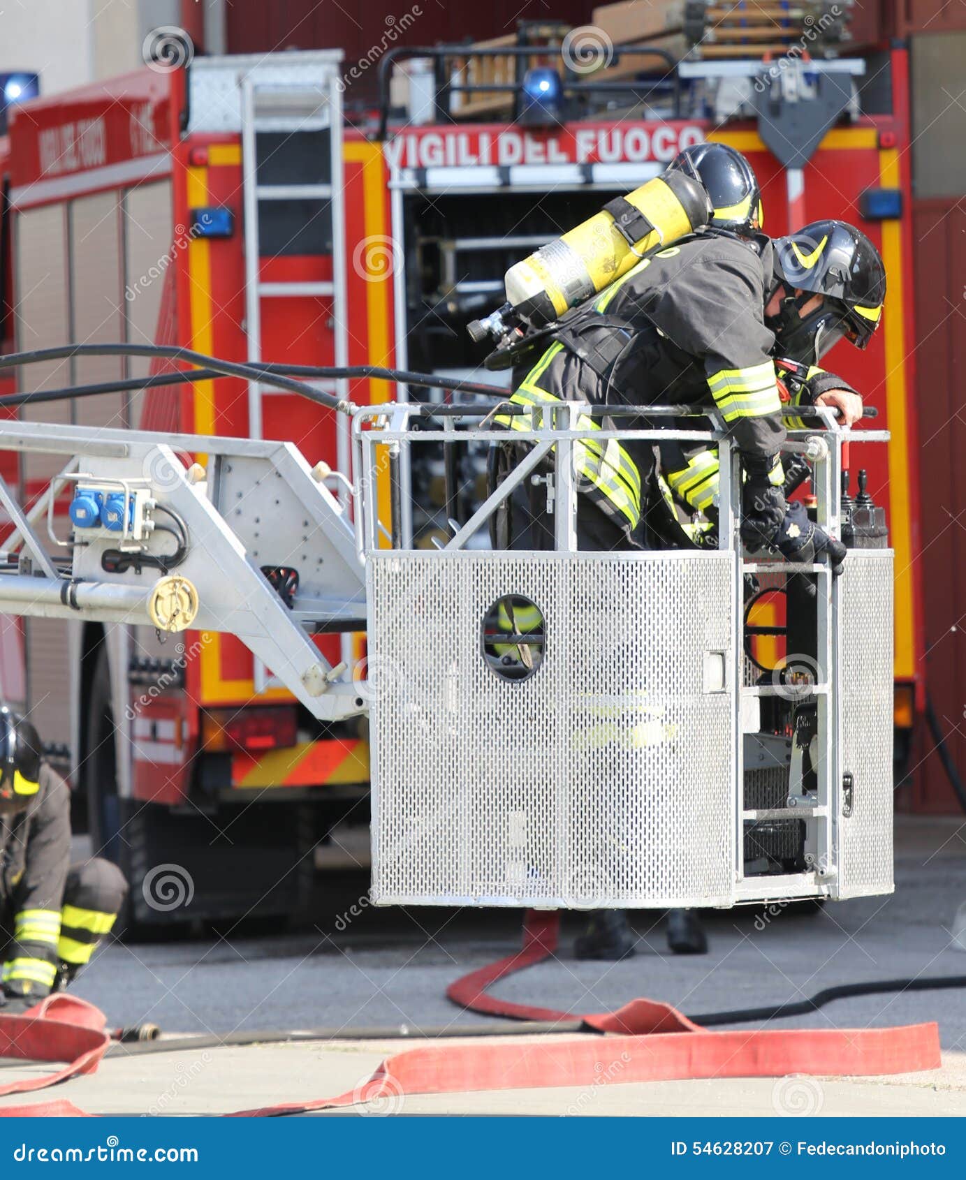 Firefighter on Cage of Fire Ladder Stock Image - Image of firefighter ...
