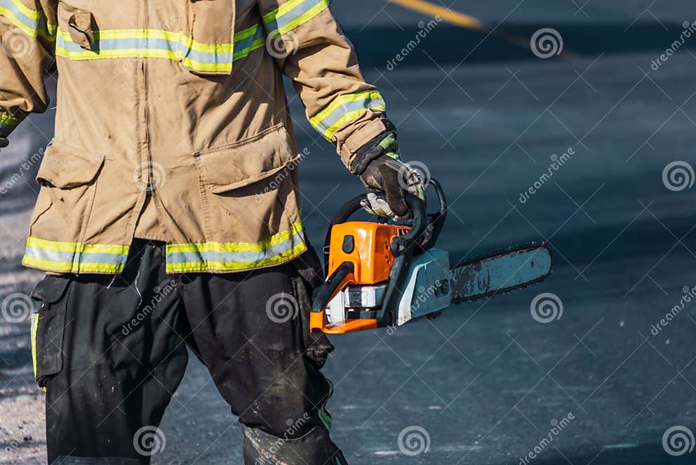 Firefighter with Chainsaw in Rescue Stock Image - Image of fireman ...