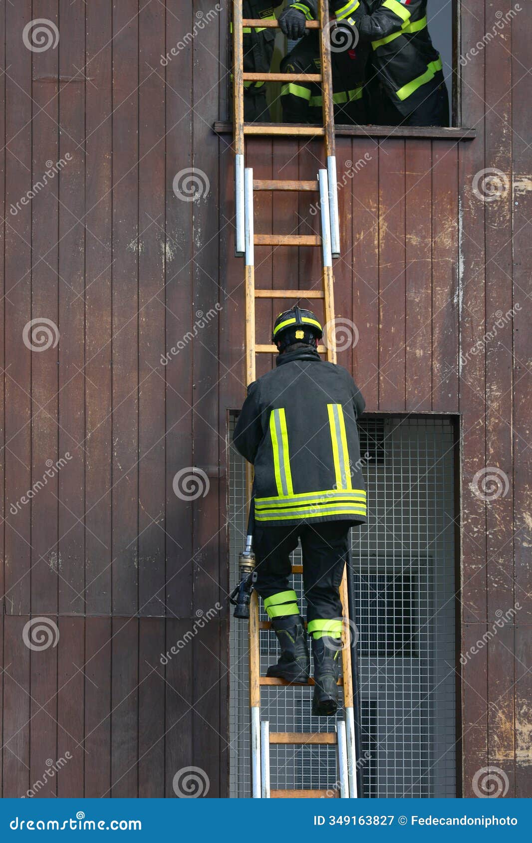 Firefighter is Climbing a Ladder during a Training Exercise at a Fire ...