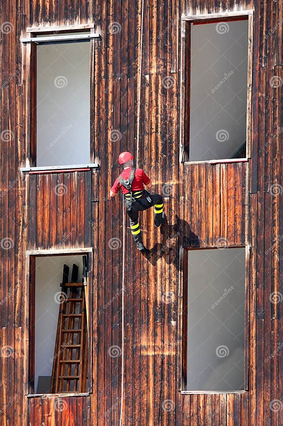 Firefighter Climbs the Building with Four Windows during Fire Drill ...