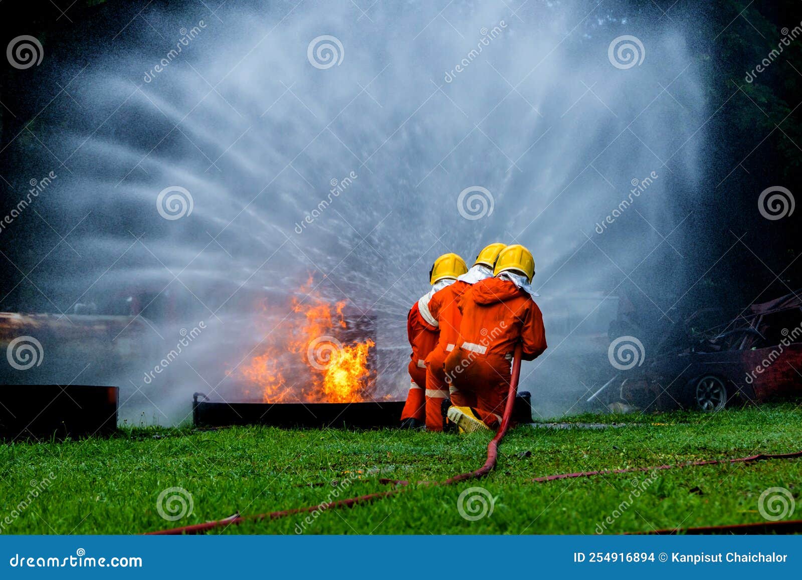 Firefighter Concept. Fireman Using Water And Extinguisher To Fighting ...
