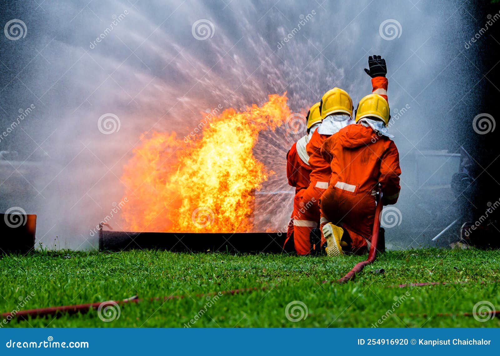 Firefighter Concept. Fireman Using Water And Extinguisher To Fighting ...