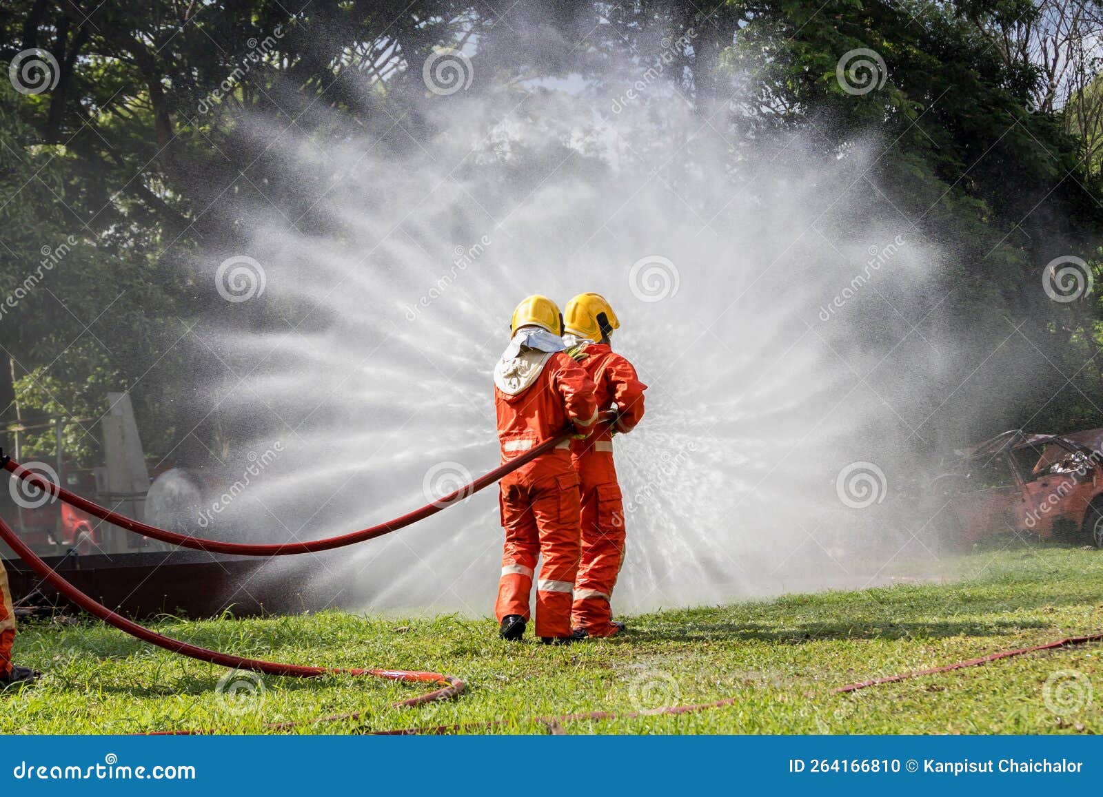 Firefighter Concept. Fireman Using Water and Extinguisher To Fighting ...