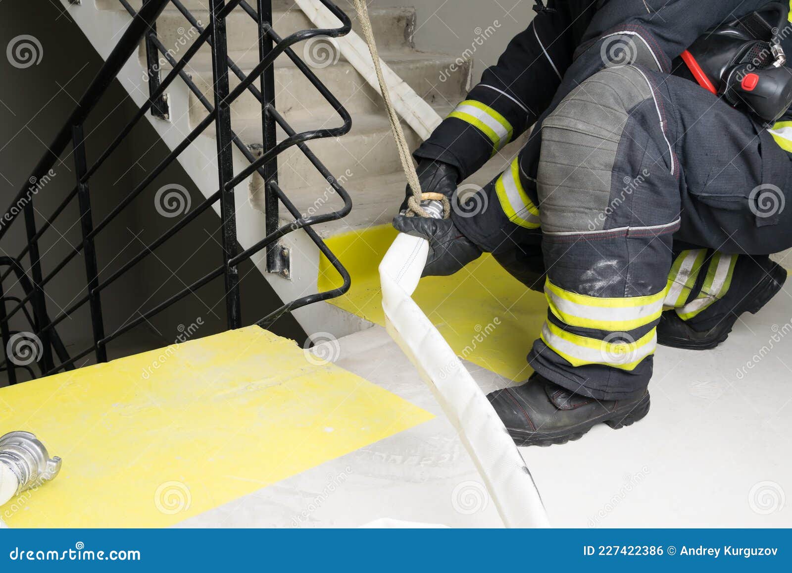 The Firefighter Connects the Water Supply Lines To the Fire Site Stock ...